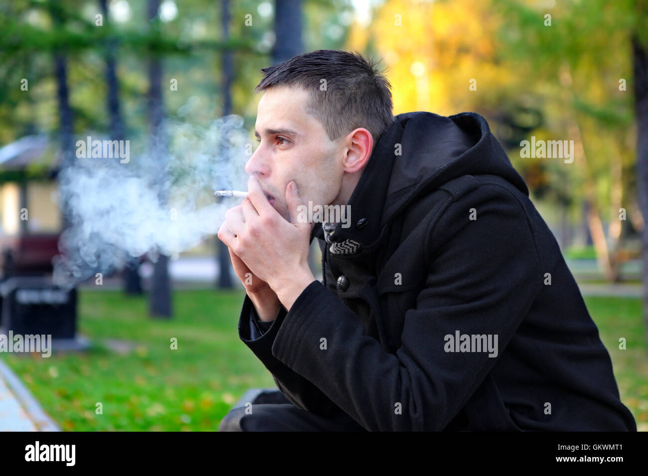 Sad Man Smoking Stock Photo - Alamy