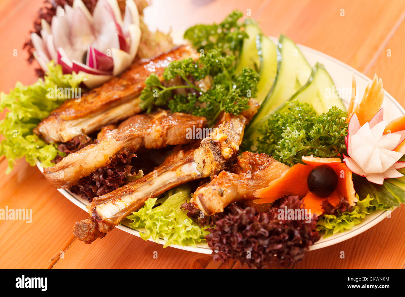 grilled ribs with vegetables Stock Photo - Alamy