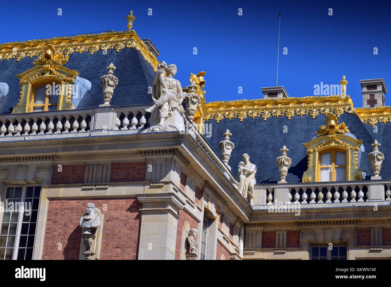 VERSAILLES, FRANCE - April 19, 2015: Beautiful roof details with golden ...