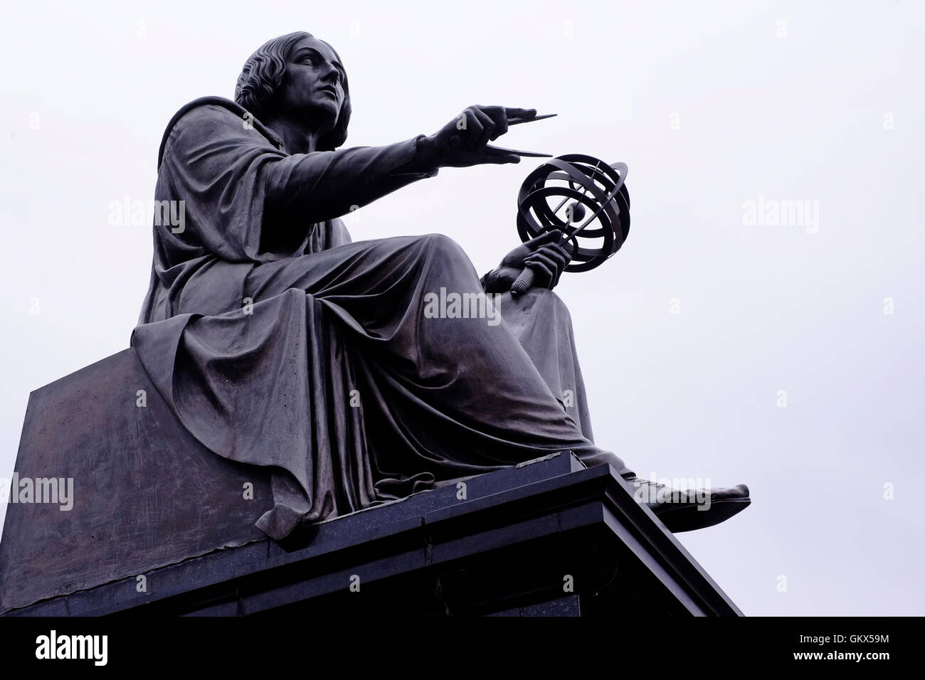 The bronze statue of astronomer Nicolaus Copernicus holding a compass ...