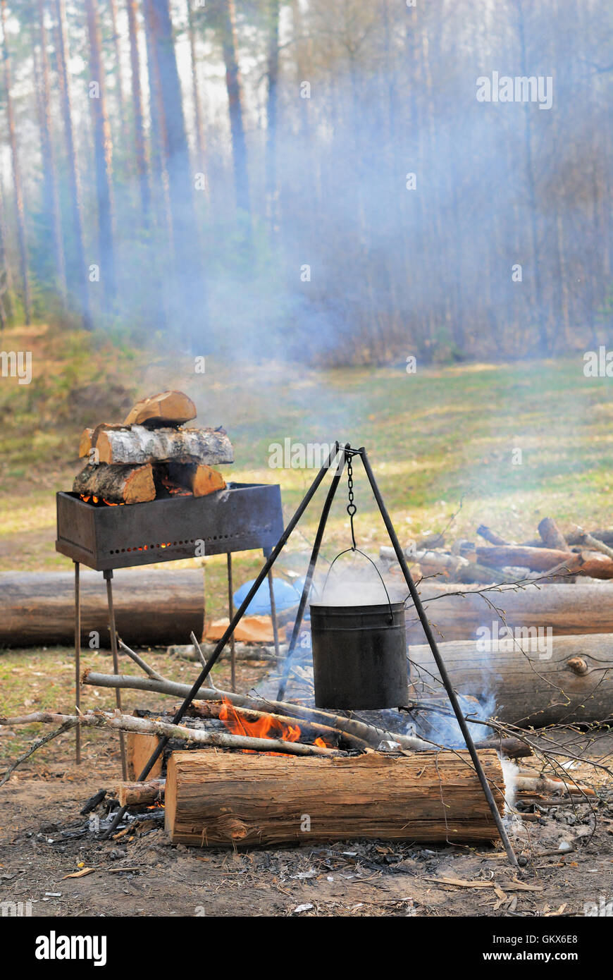 Kettle over campfire Stock Photo - Alamy