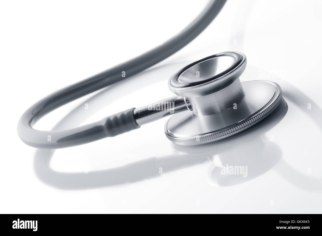 Close up view of grey stethoscope on white back Stock Photo - Alamy