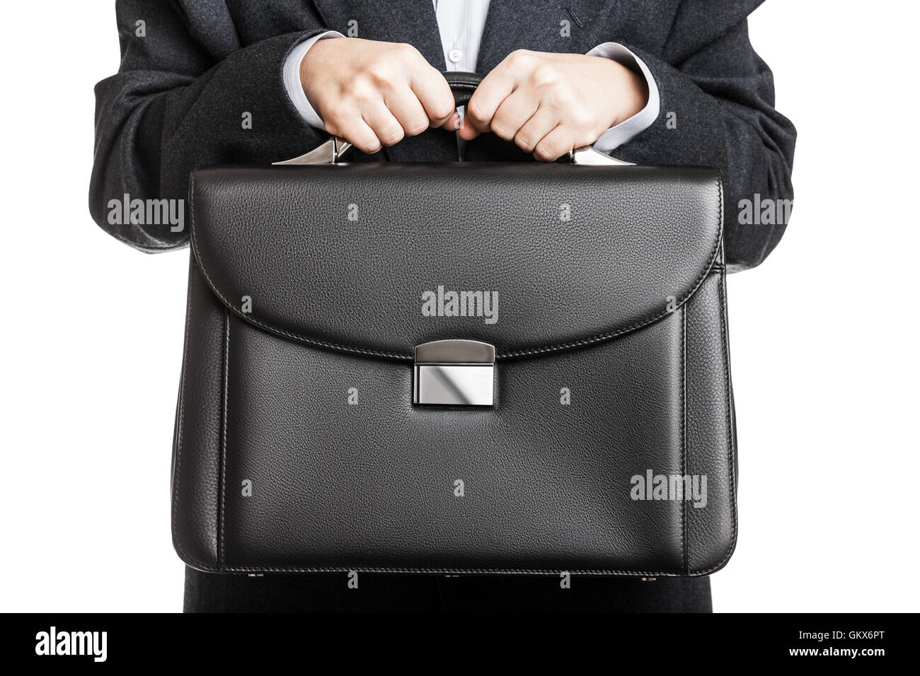 Businessman hand holding briefcase Stock Photo - Alamy
