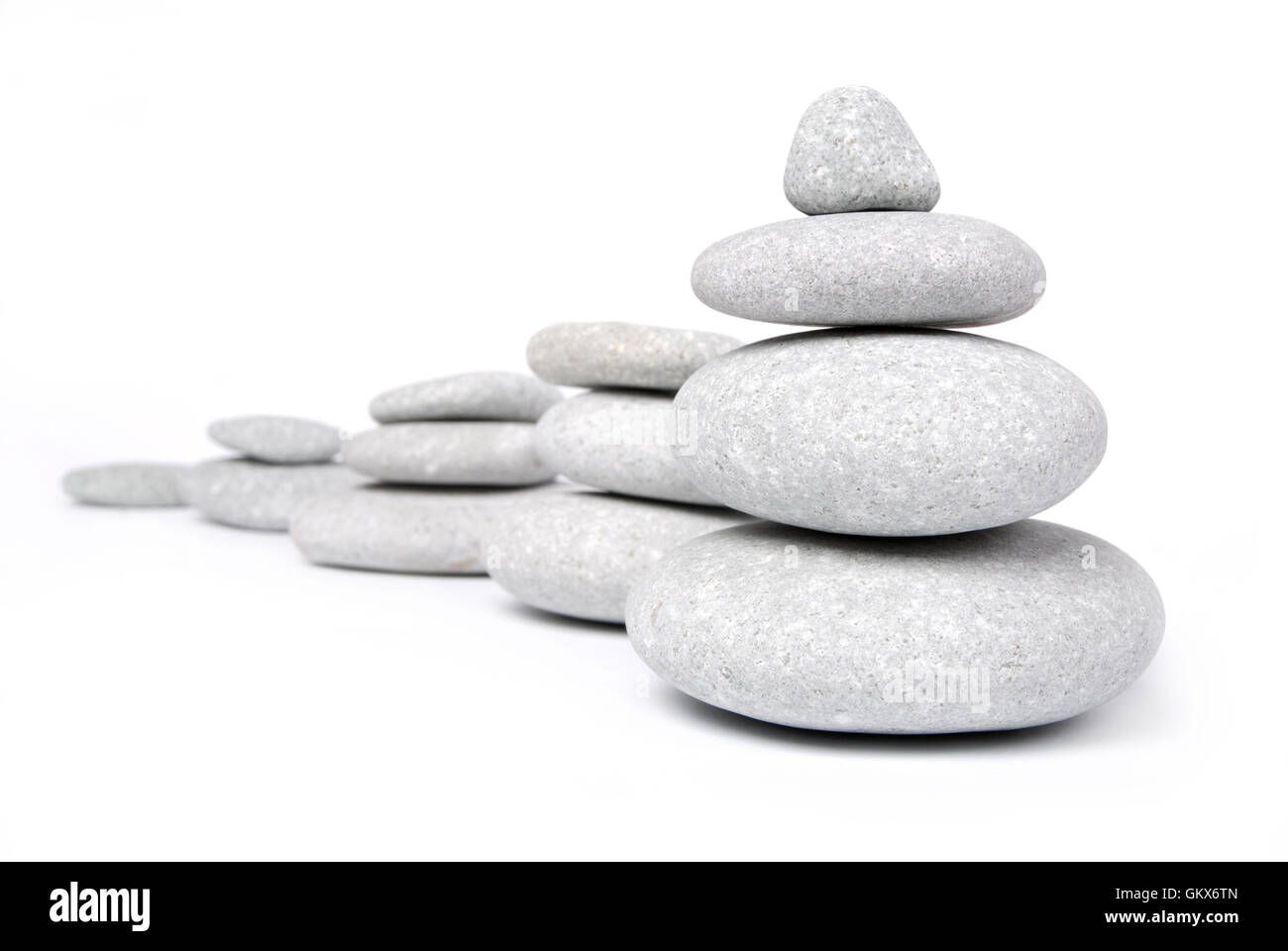 Stone pyramid over white Stock Photo - Alamy