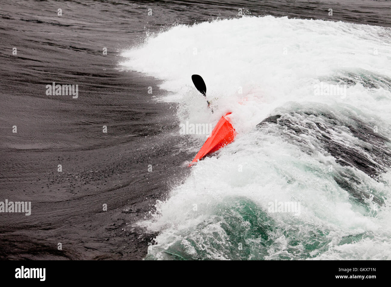 Kayaker in white water paddling breaking waves Stock Photo - Alamy
