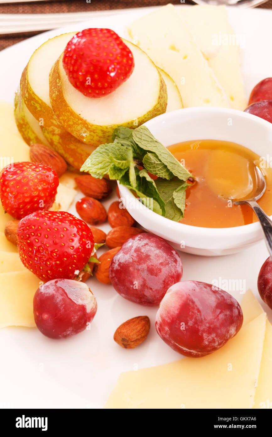 cheese and fruits for appetizer Stock Photo - Alamy