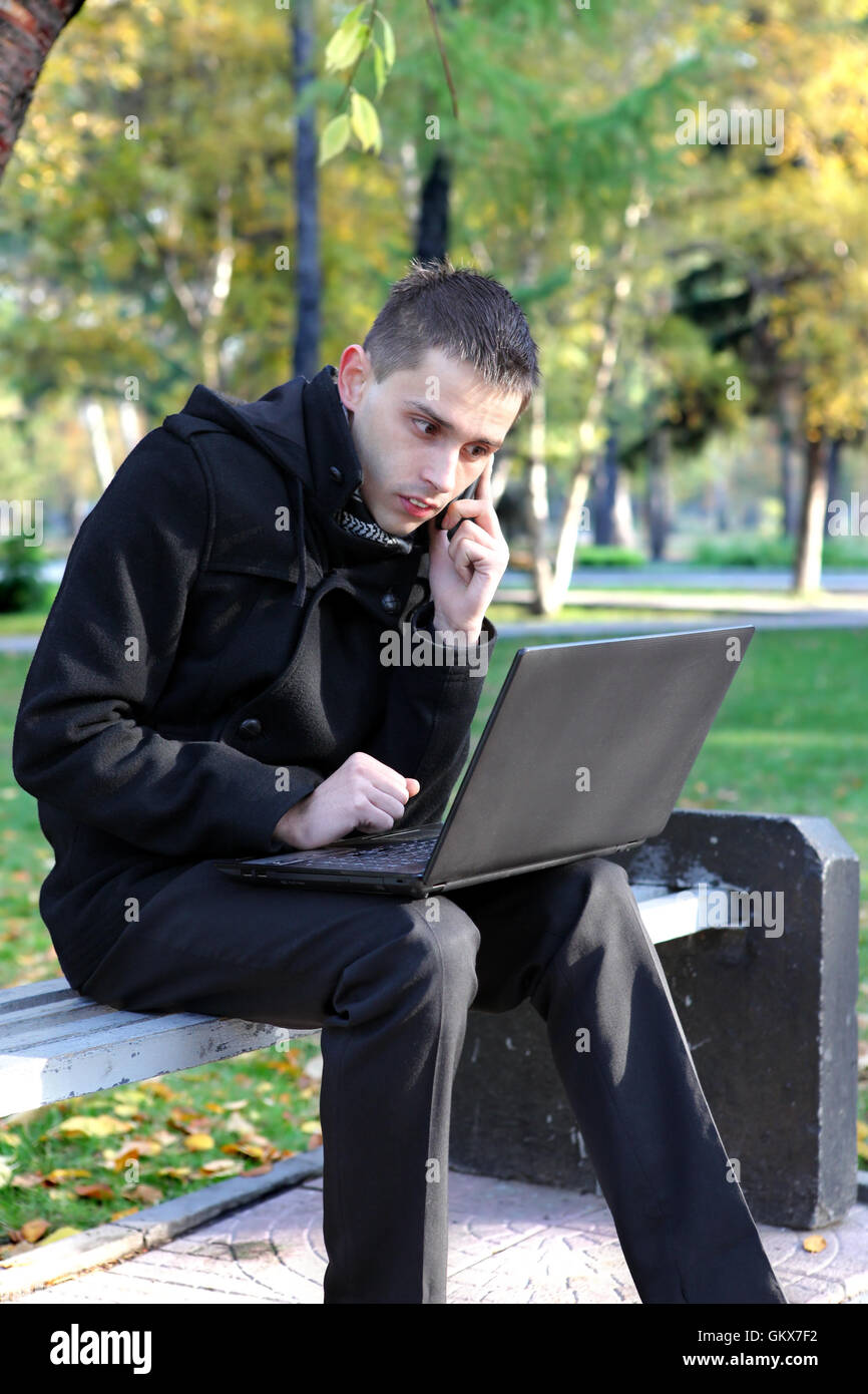 Man With Laptop Outdoor Stock Photo - Alamy