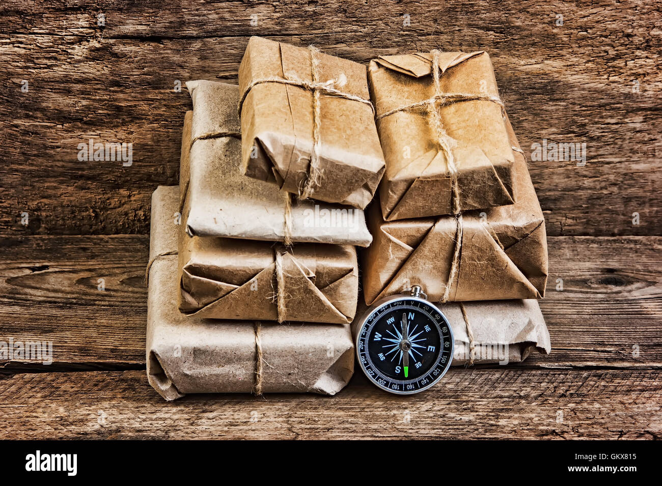 Postage on the background of an old board Stock Photo - Alamy