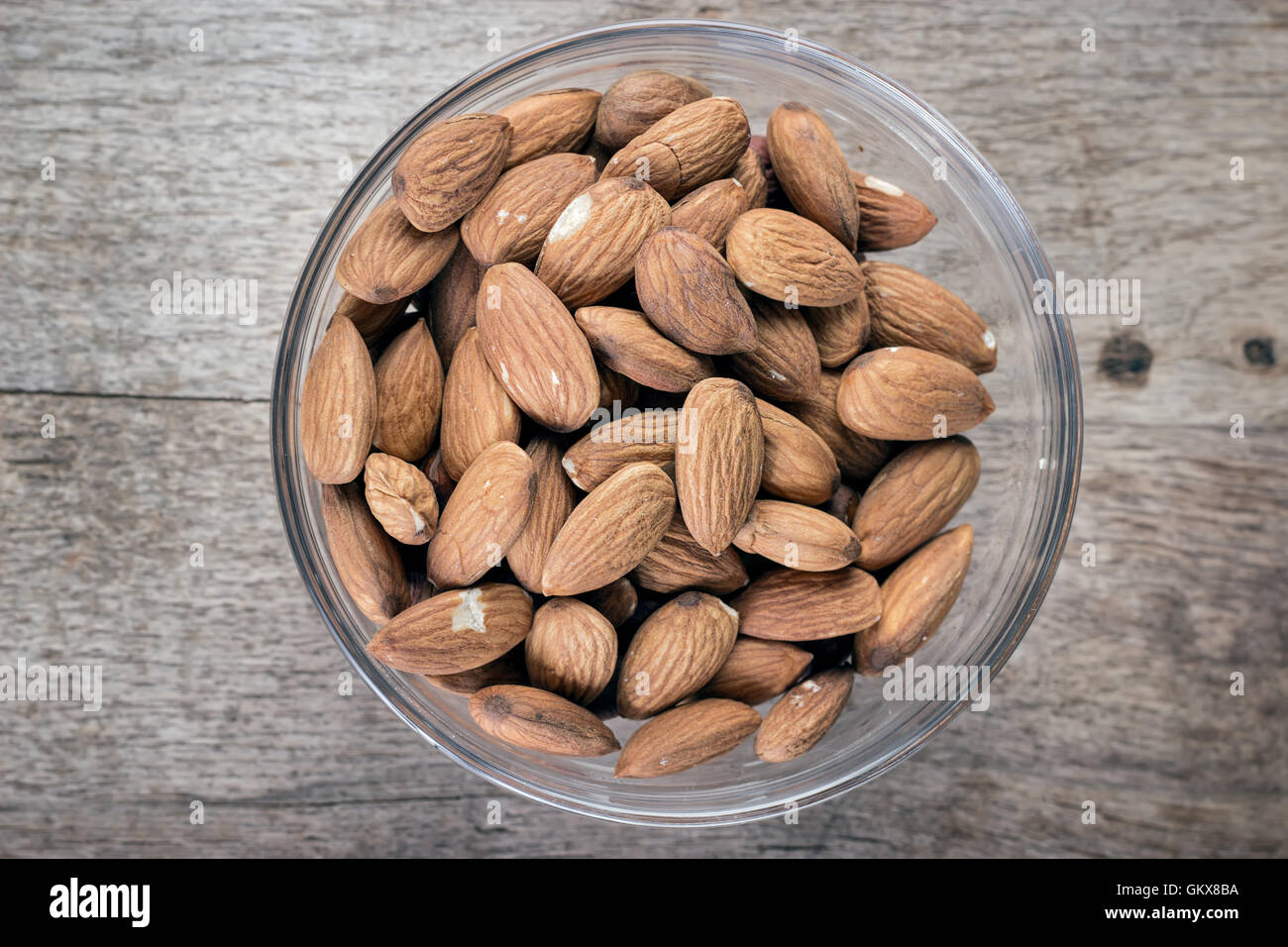 almonds in a glass bowl Stock Photo - Alamy