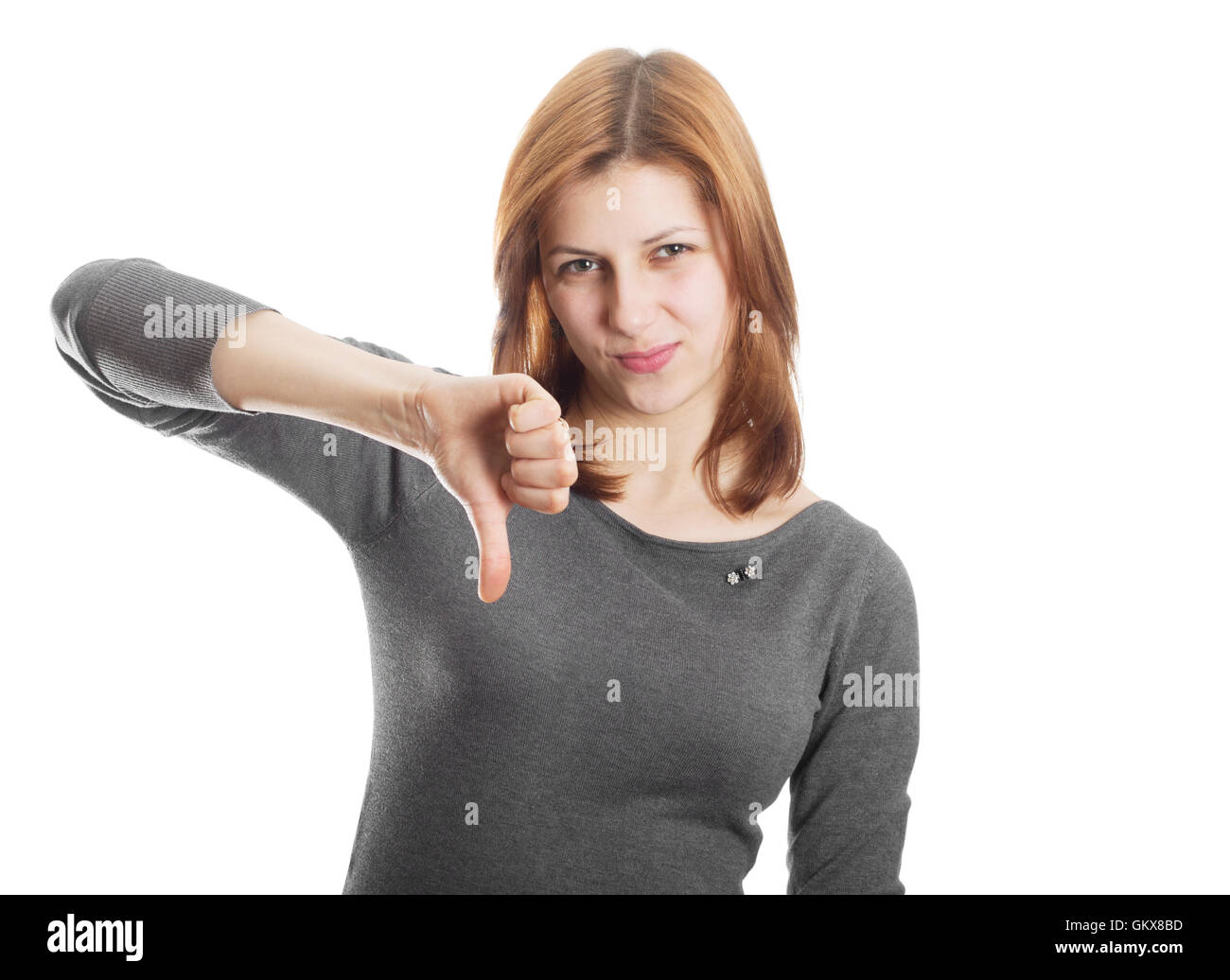 attractive girl with disdain on his face, pointed their thumbs d Stock ...