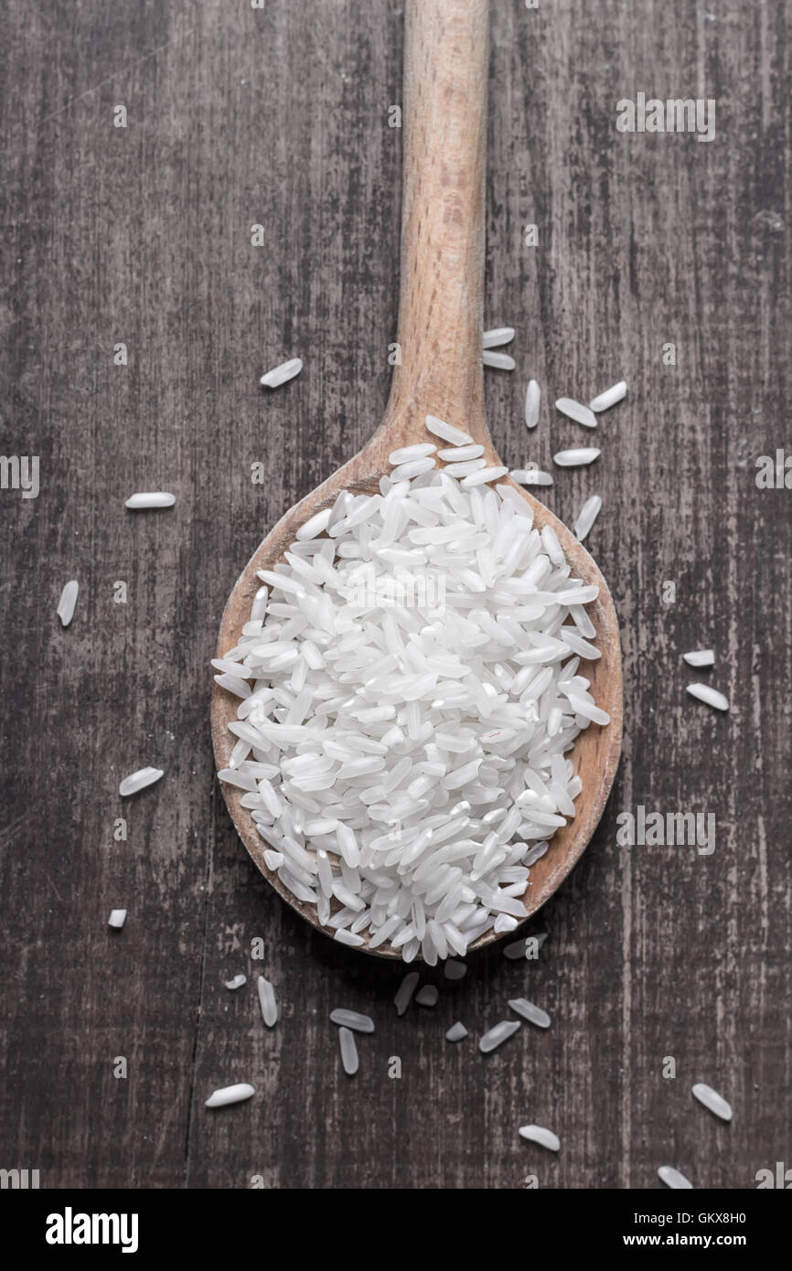 Rice With Wooden Spoon Stock Photo - Alamy