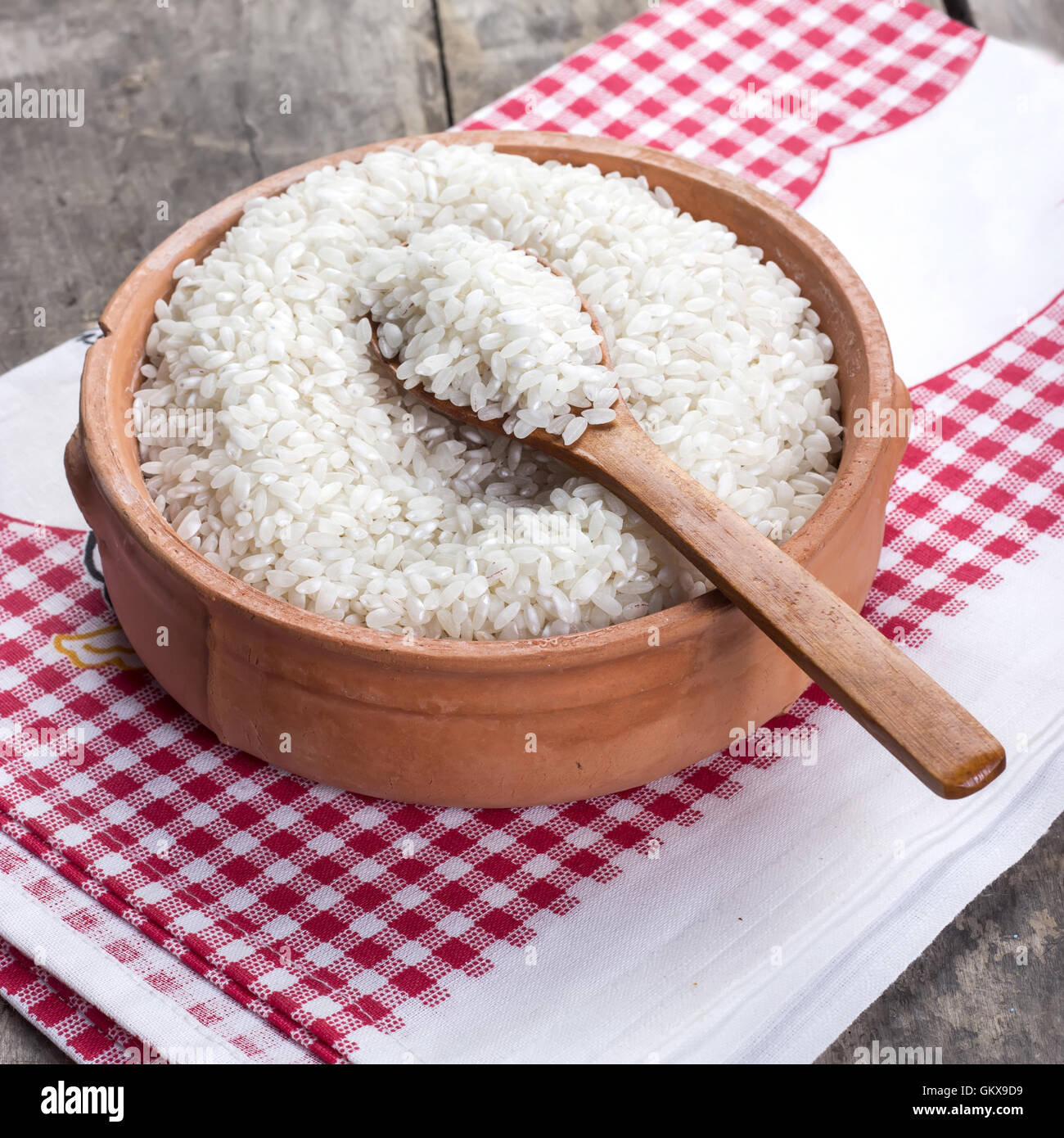 rice on wooden spoon Stock Photo - Alamy