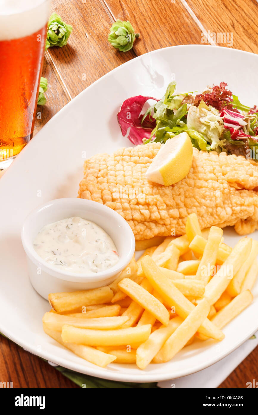 fish with french fries potatoes Stock Photo - Alamy