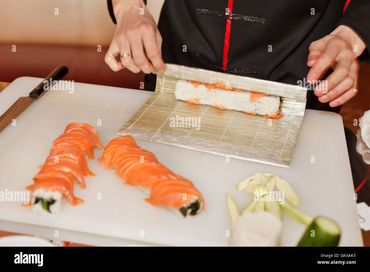 chef preparing sushi in the kitchen Stock Photo - Alamy
