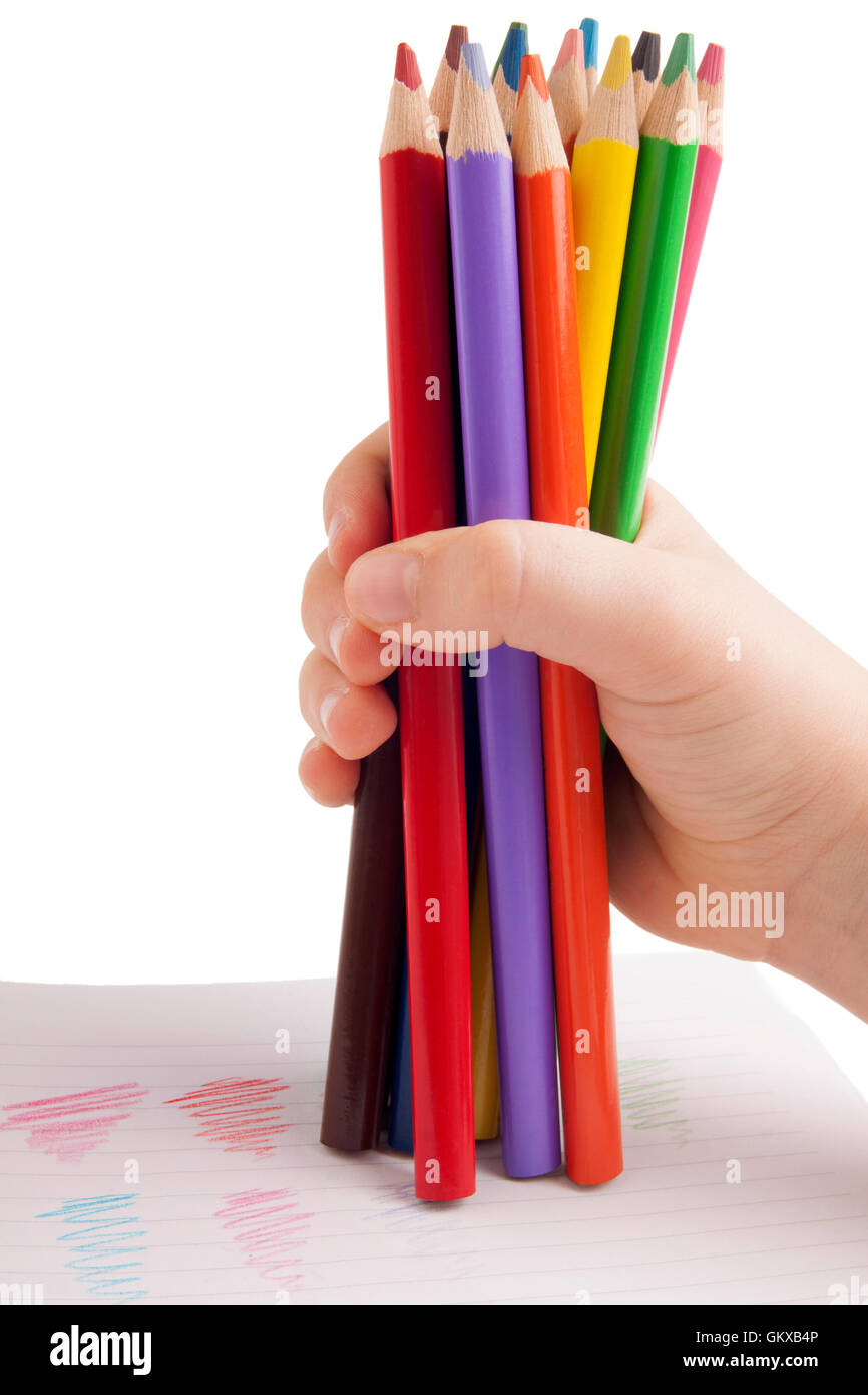 Color pencils in child hand Stock Photo - Alamy