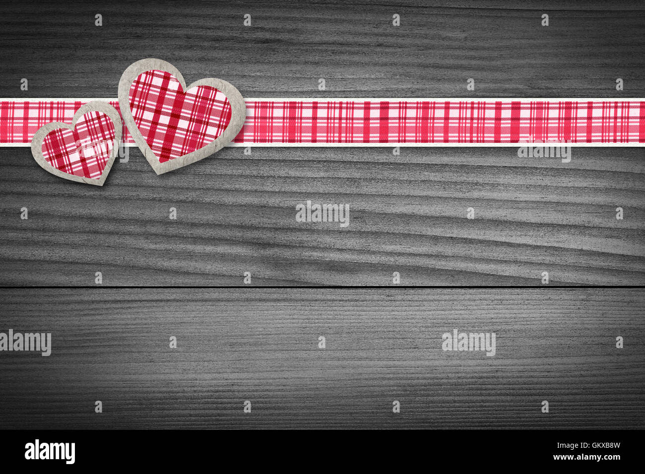 Two hearts laying on wood Stock Photo - Alamy