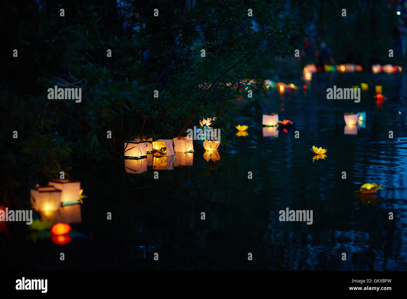 Burning lights on water surface Stock Photo - Alamy