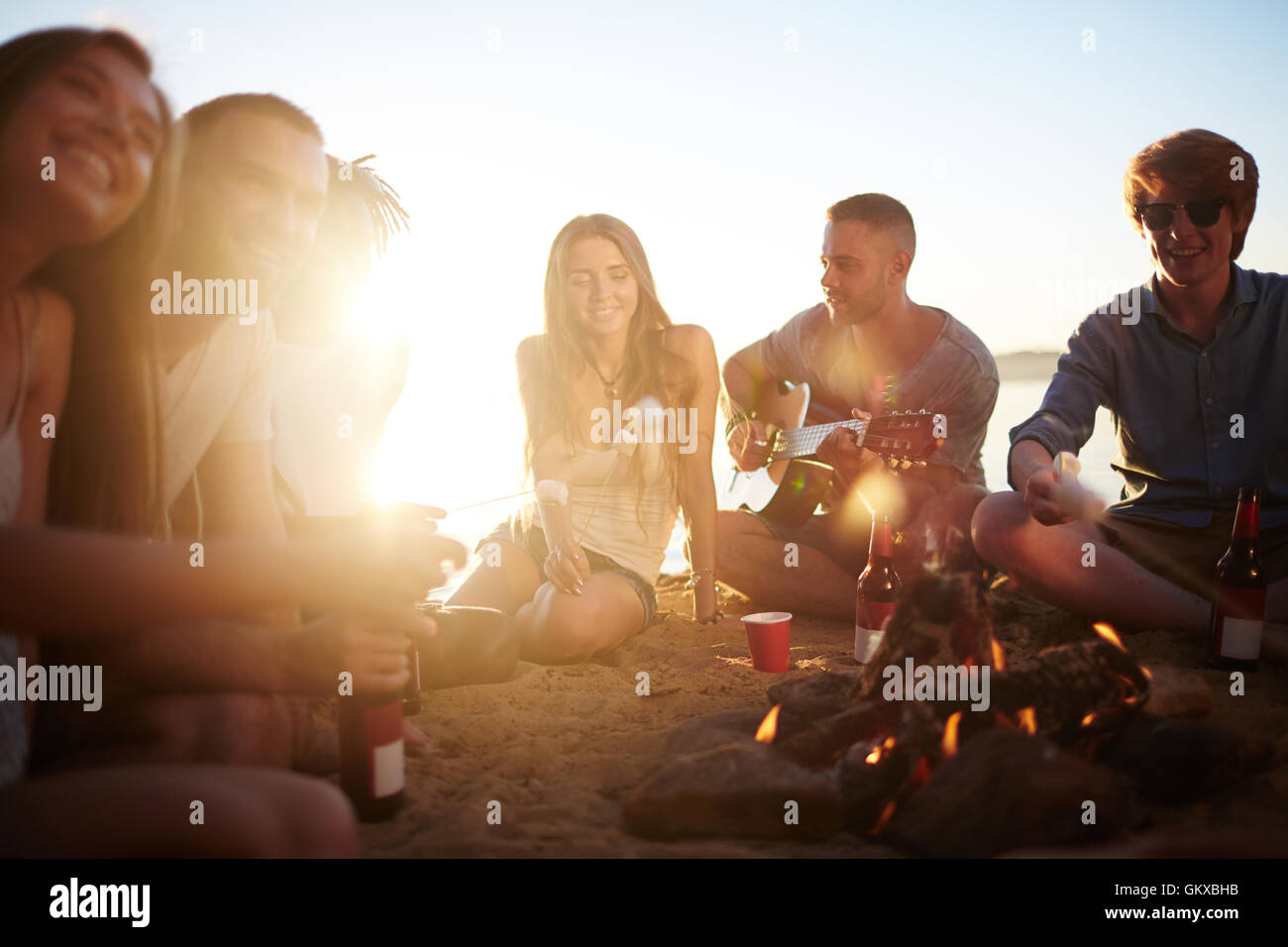 Friends near the fire hi-res stock photography and images - Alamy