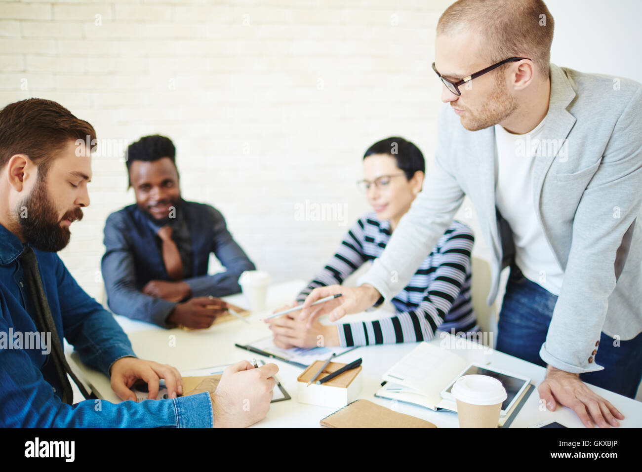 Confident businessman sharing his idea during discussion Stock Photo ...