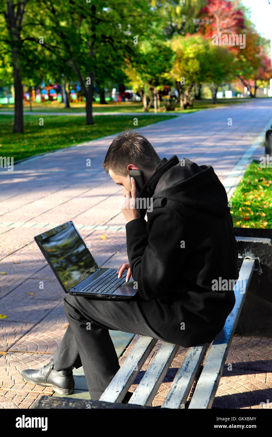 Man With Laptop At The Park Stock Photo - Alamy