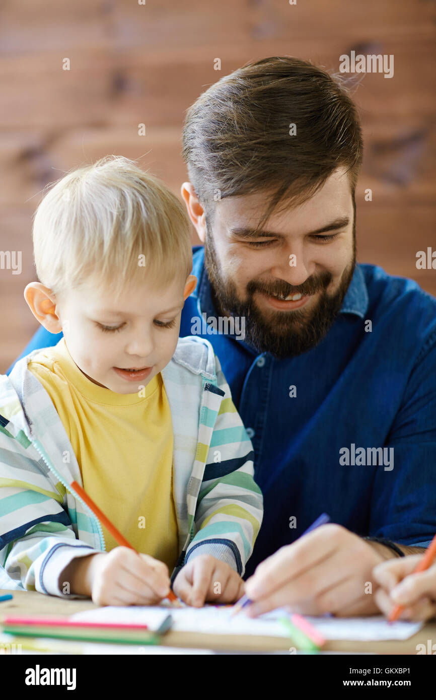 Father and son drawing with pencils Stock Photo - Alamy