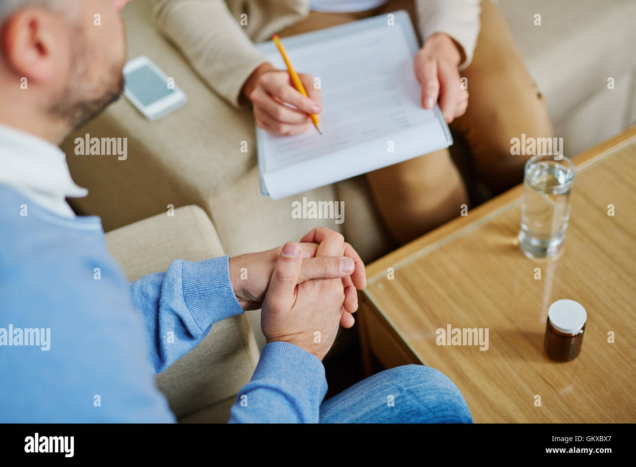 Hands of stressed man showing tensity Stock Photo - Alamy