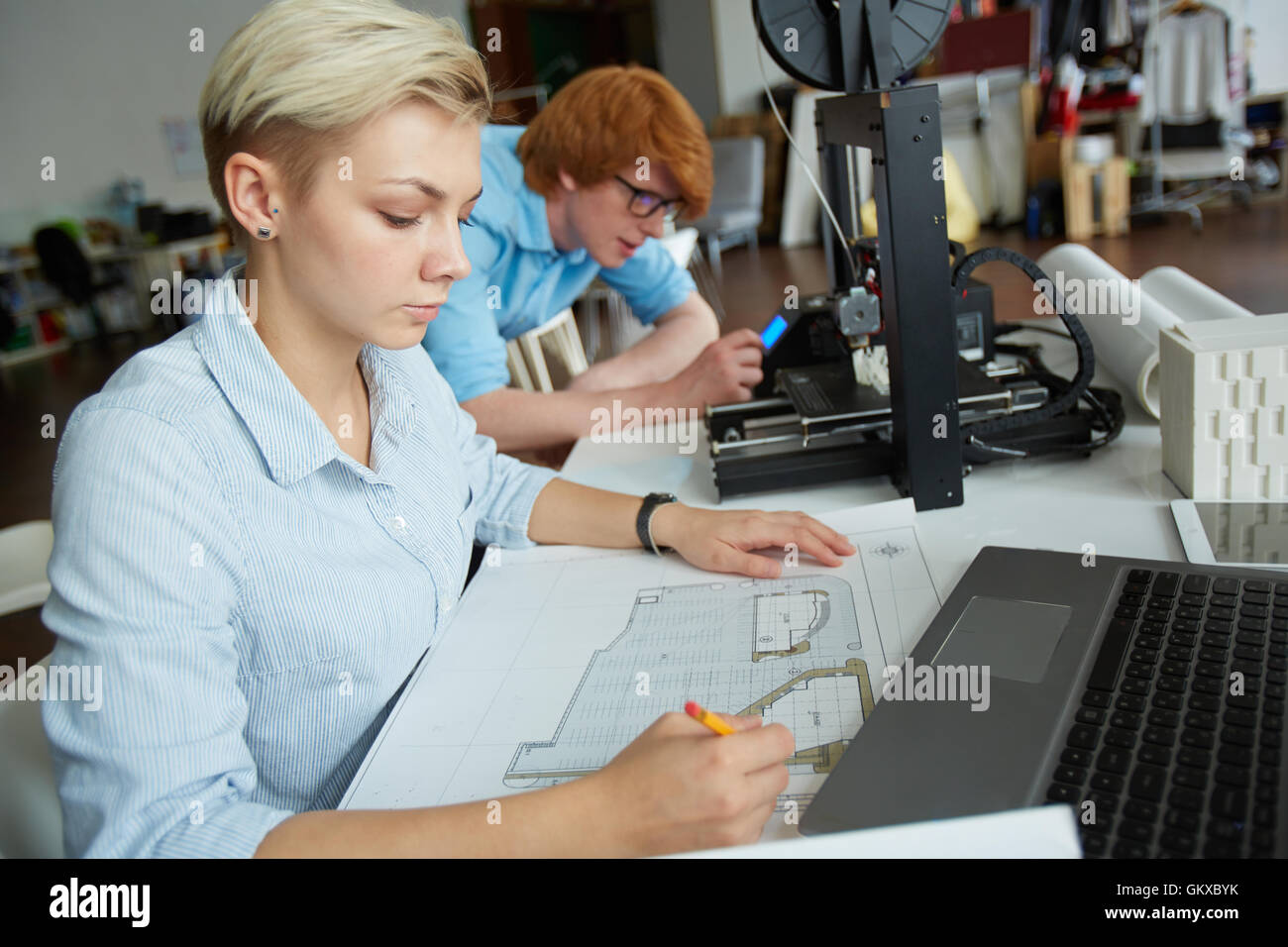 Engineer looking at sketch during work Stock Photo - Alamy