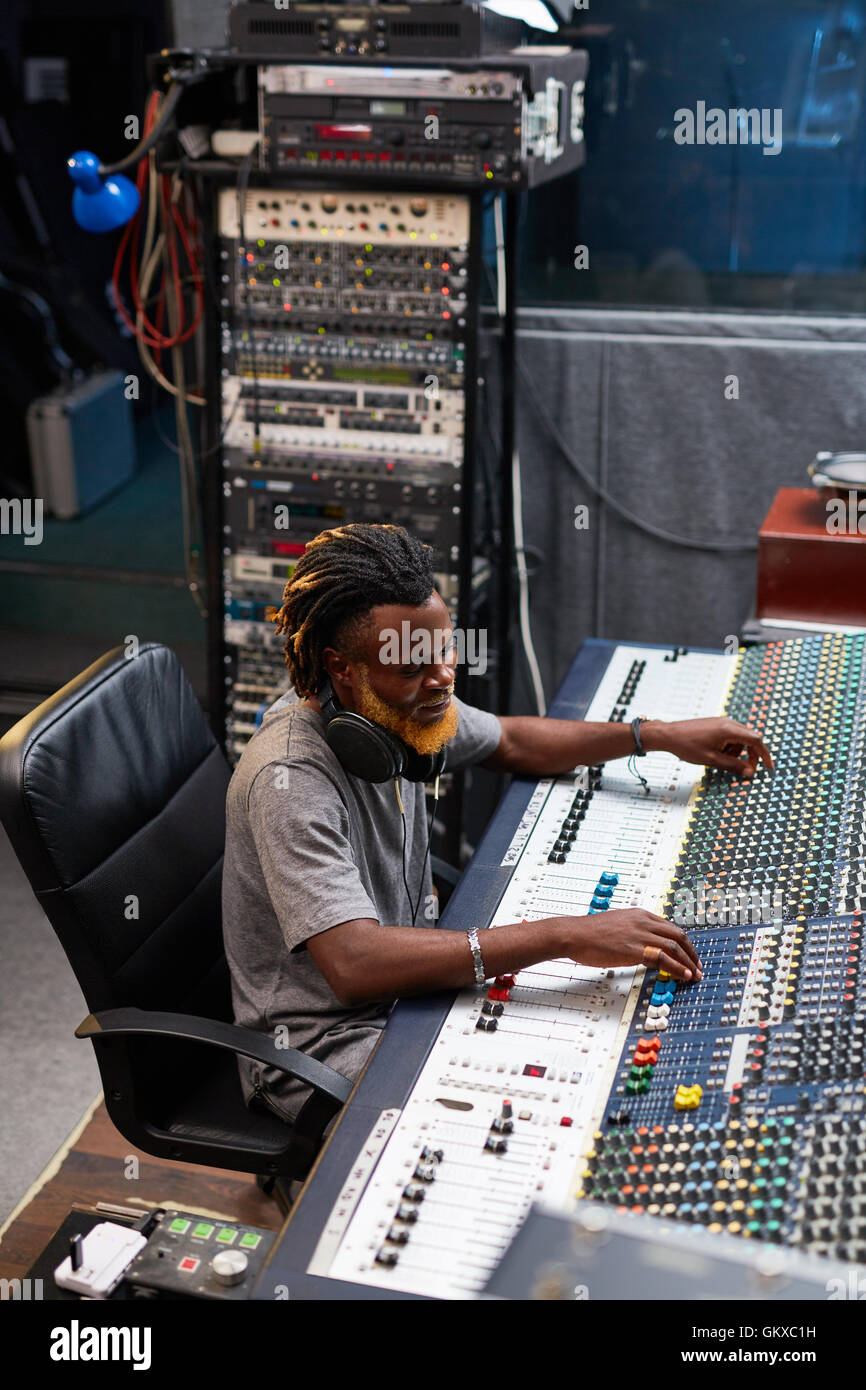 Musician or sound operator working in studio of sound Stock Photo - Alamy