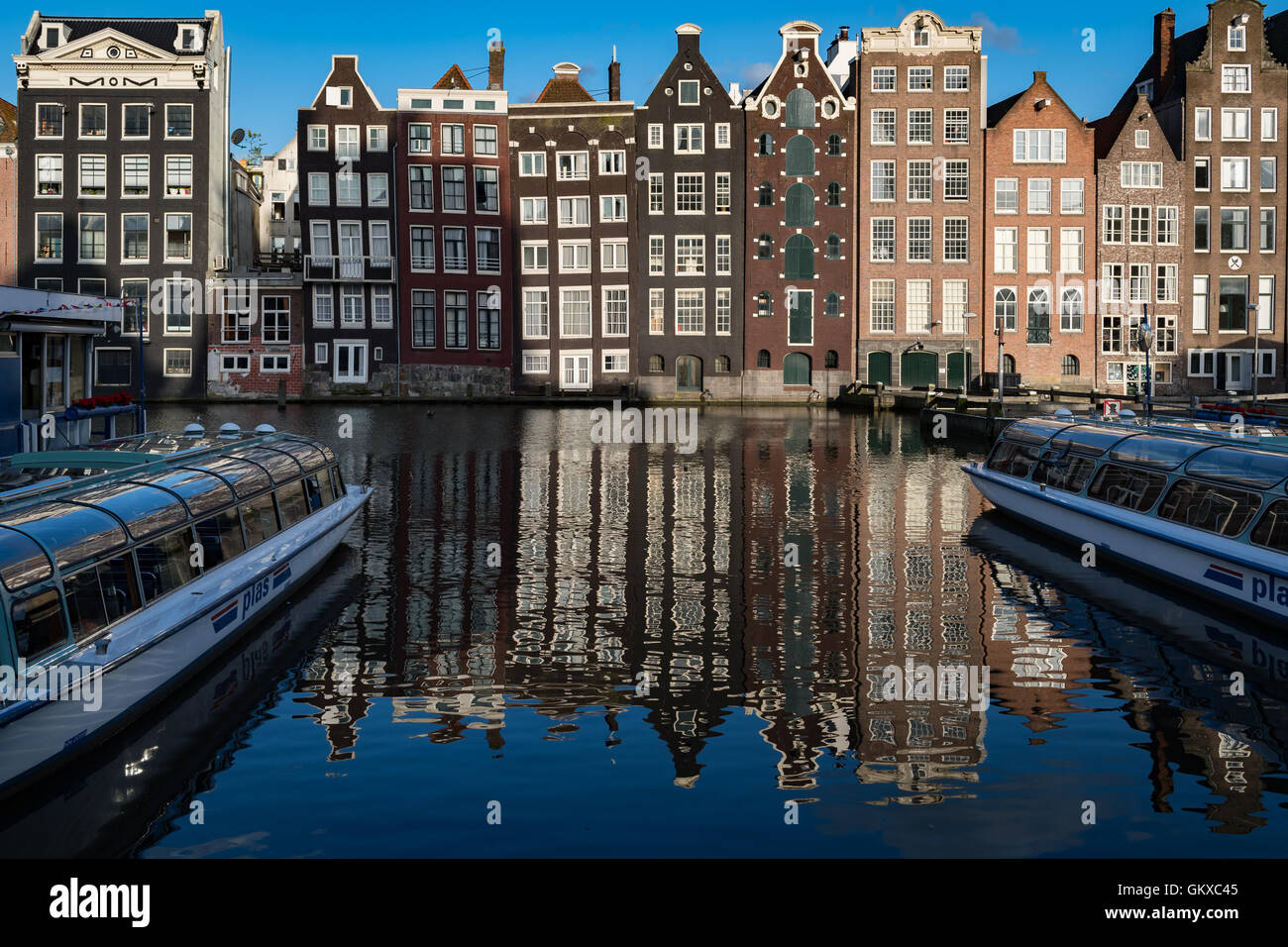 Crooked buildings reflected at dusk in Amsterdam, Netherlands Stock ...