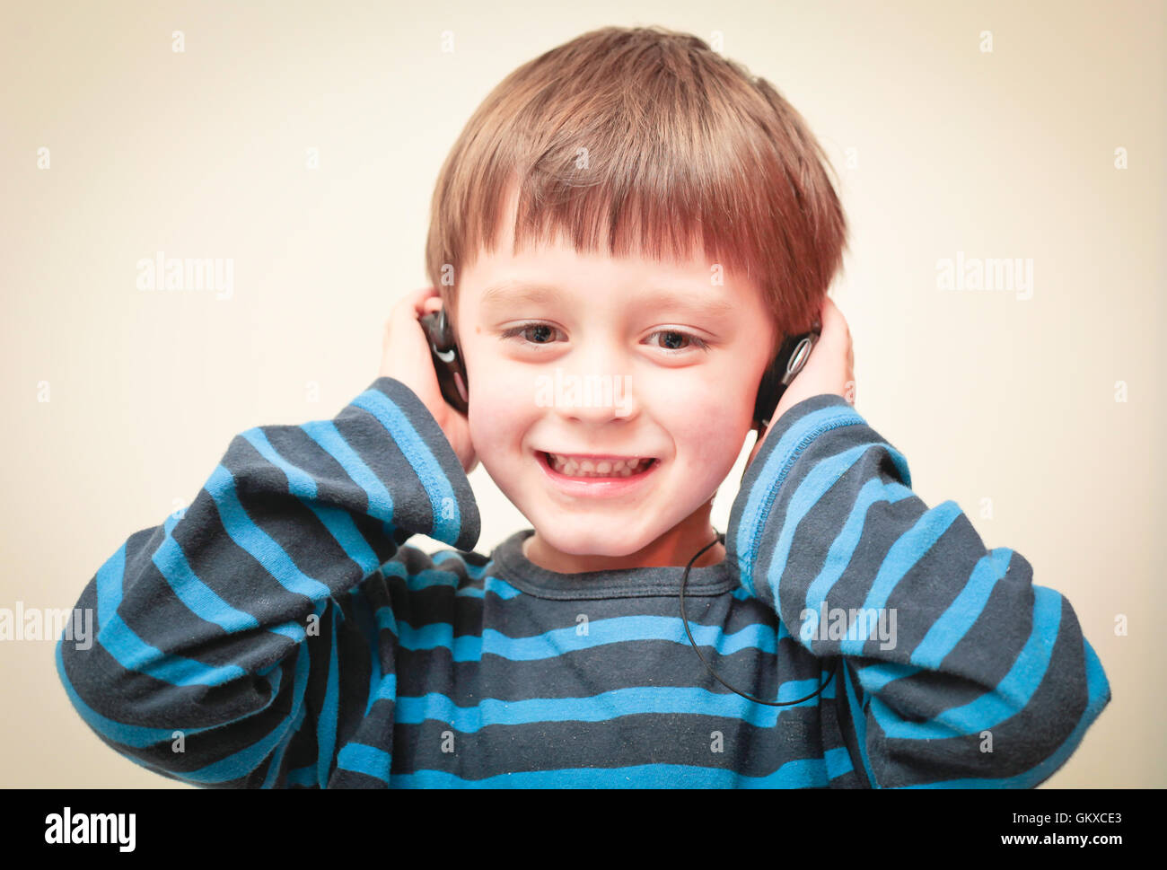 Boy with ear phones Stock Photo - Alamy
