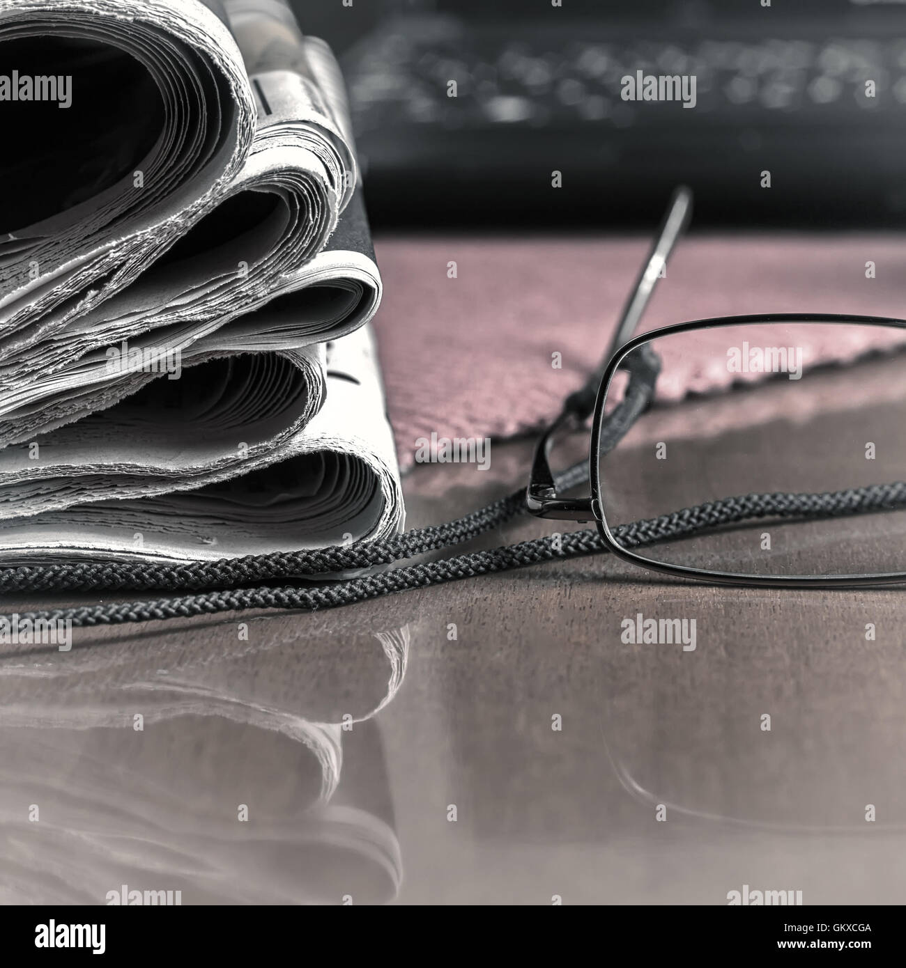 pile of newspaper & glasses Stock Photo - Alamy