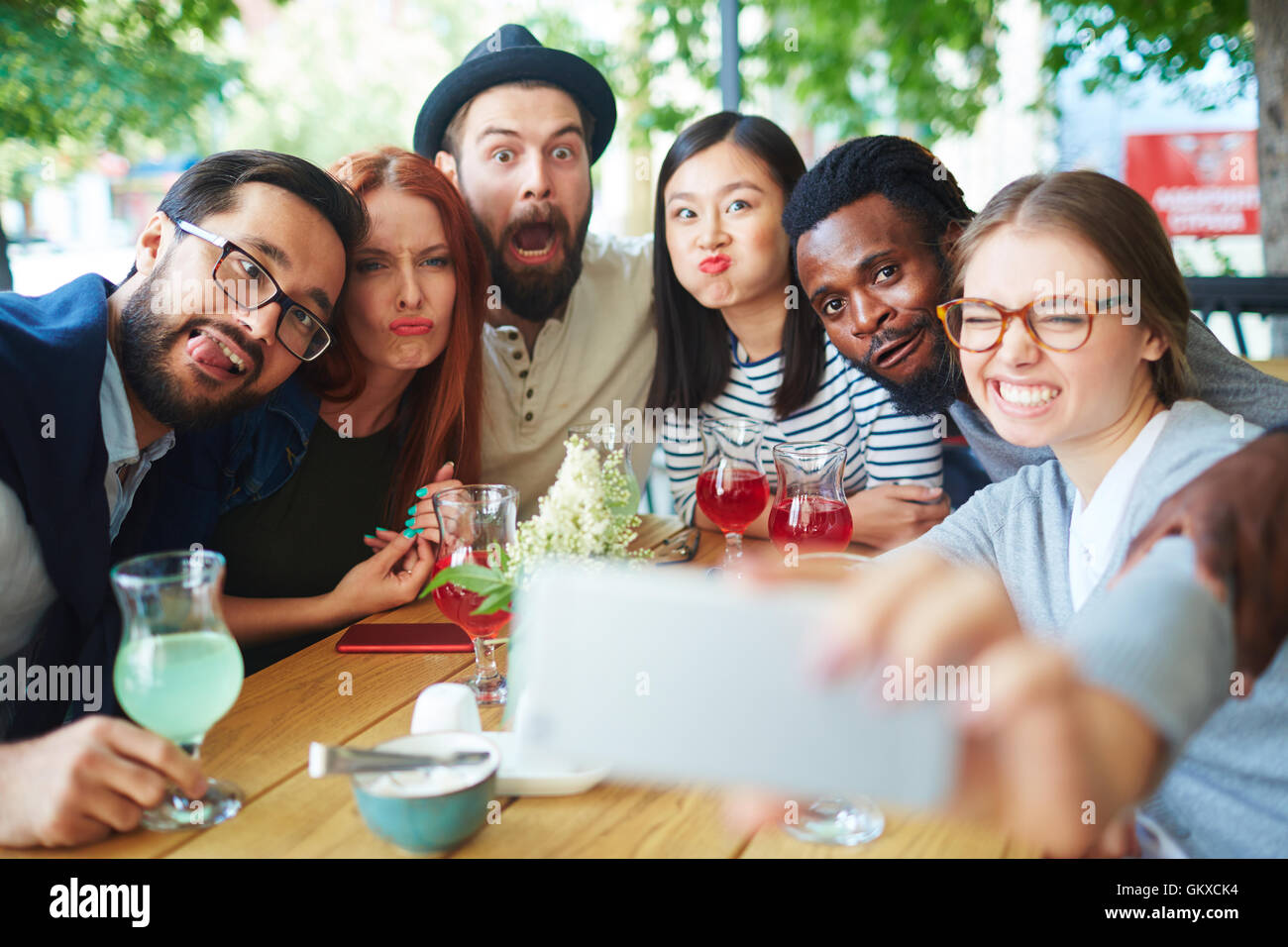 Group of freinds making funny faces for selfie Stock Photo - Alamy