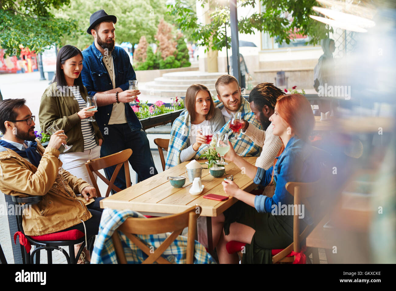 Teenage friends spending time in cafe Stock Photo - Alamy
