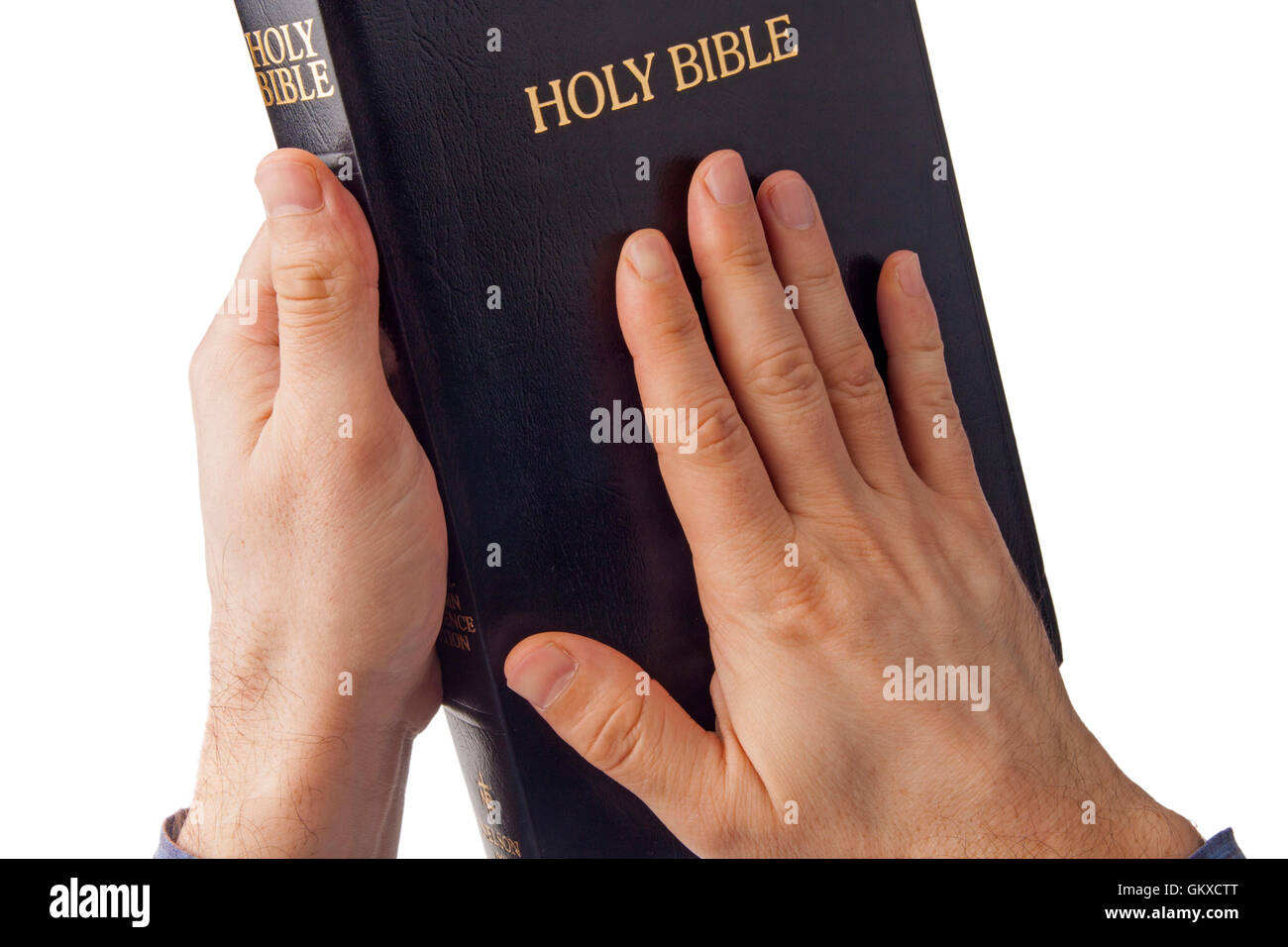 Holy bible in human hands Stock Photo - Alamy