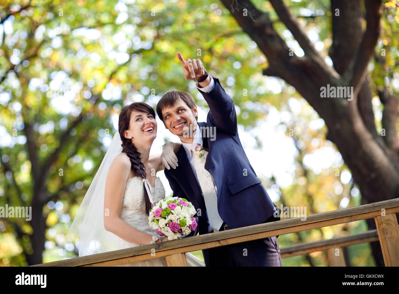 Bride and groom pointing hi-res stock photography and images - Alamy