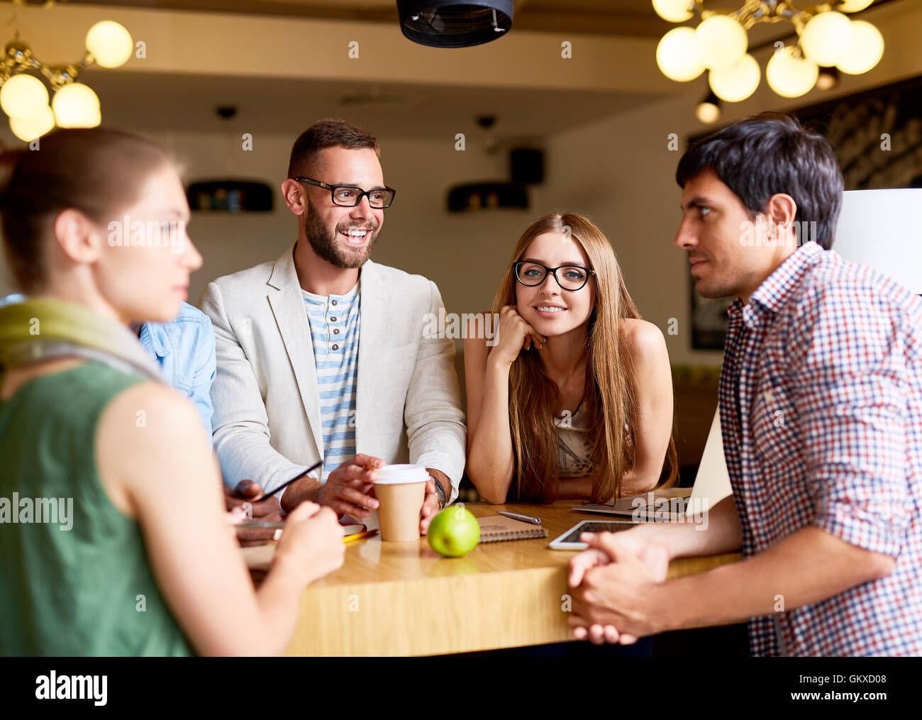 Creative young people discussing new ideas for new business project ...