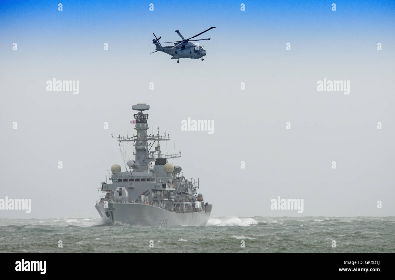 Royal Navy ship and helicopters at sea training ©Clifford Norton/Alamy ...