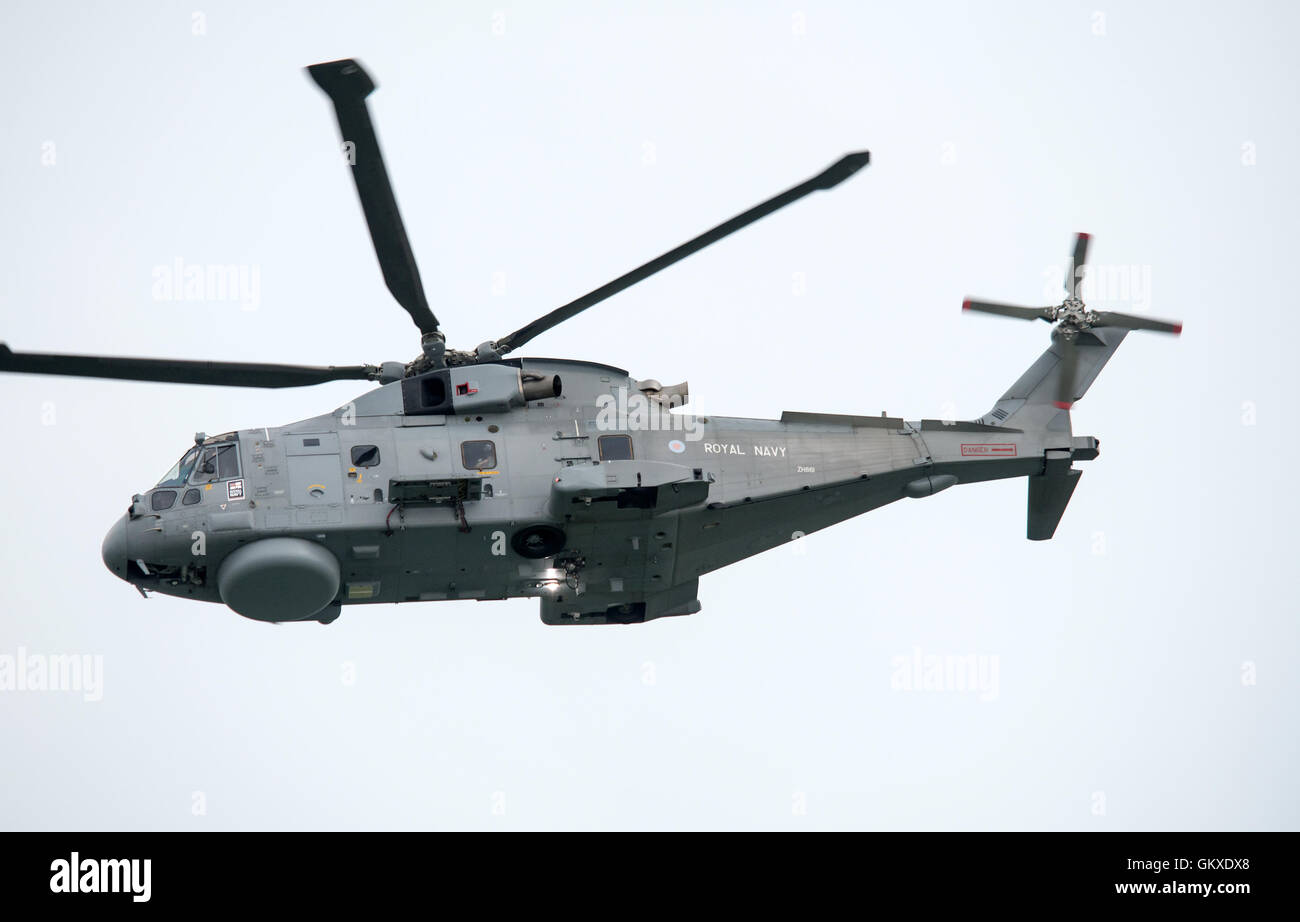 Royal Navy ship and helicopters at sea training ©Clifford Norton/Alamy ...