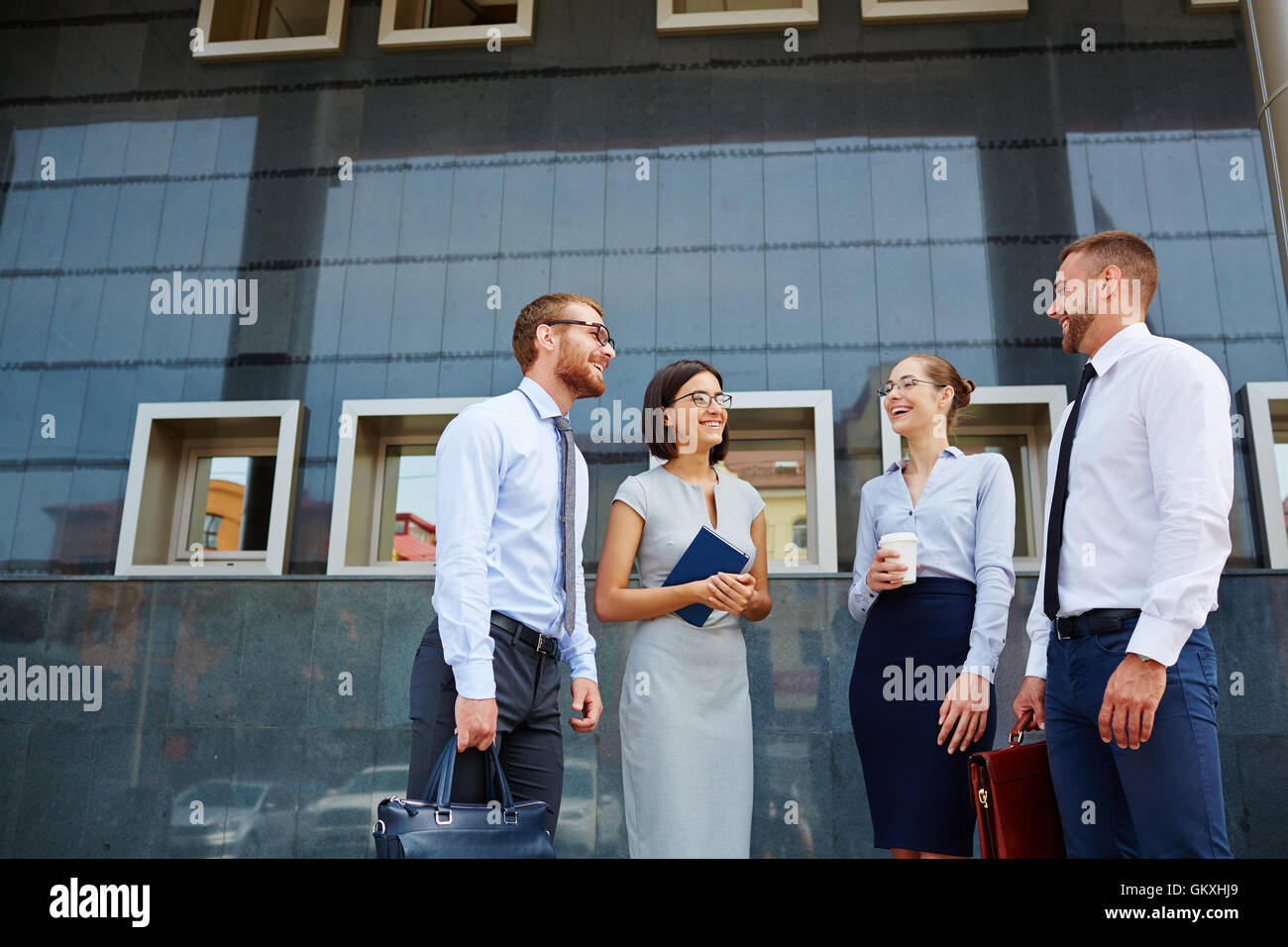 Business team having chat after work Stock Photo - Alamy
