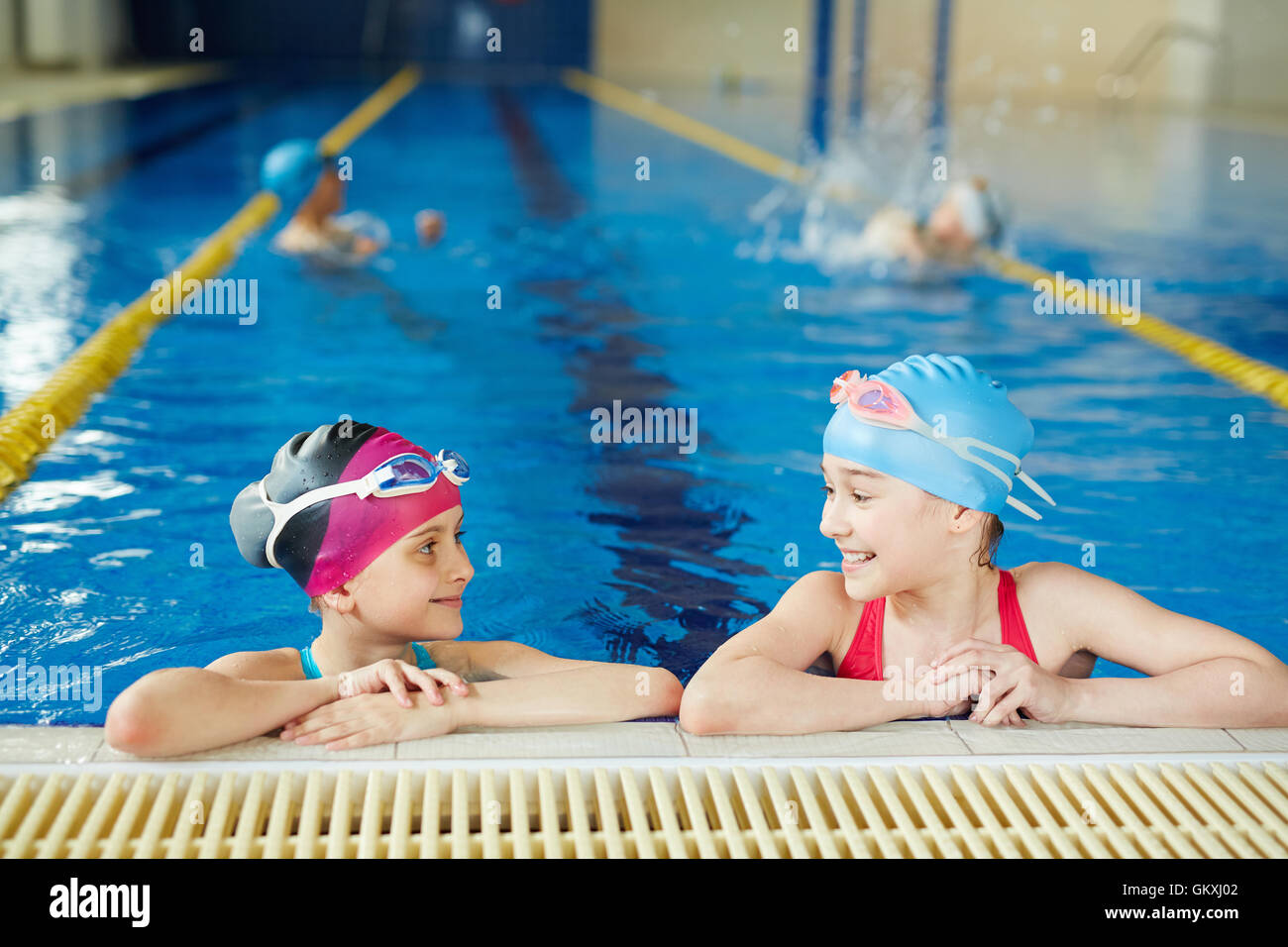 Portrait two friends in pool hi-res stock photography and images - Alamy