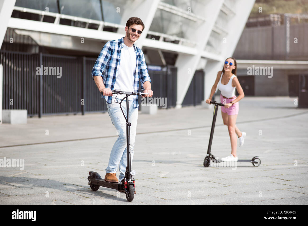 Riding electric scooters together hi-res stock photography and images ...