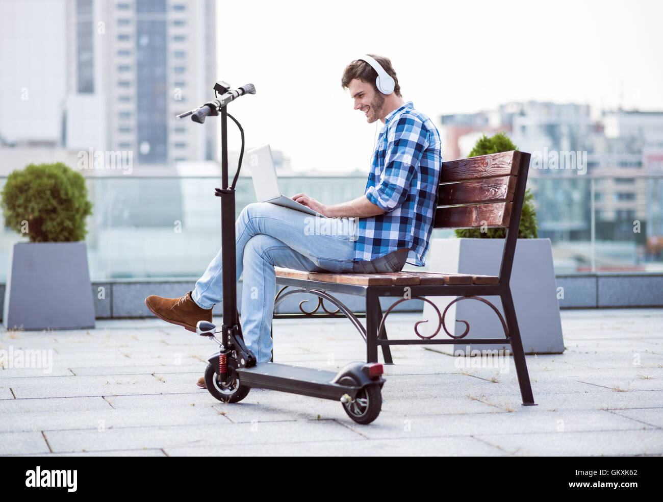 Positive man resting on the bench Stock Photo - Alamy