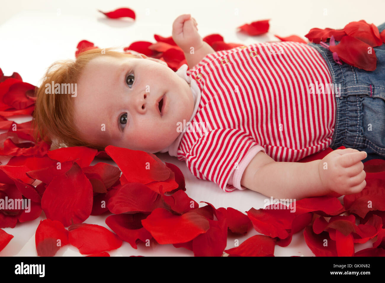 Cute Babies In Red Roses