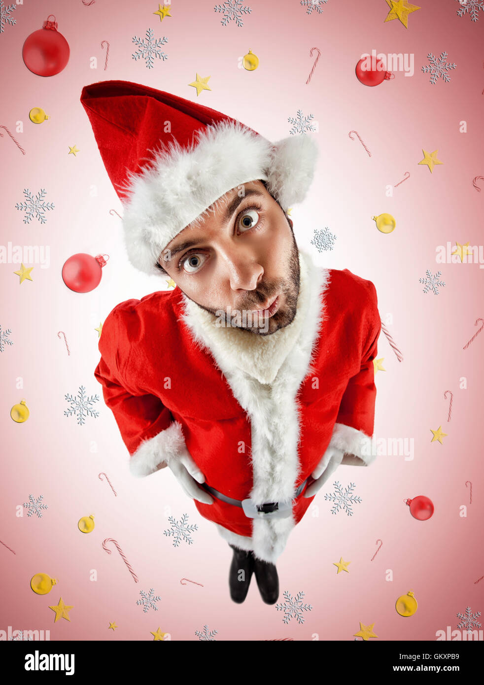 Surprised man as santa claus on white background Stock Photo - Alamy