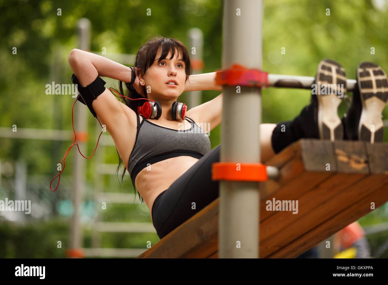Brunette woman in workout clothes doing sports Stock Photo - Alamy