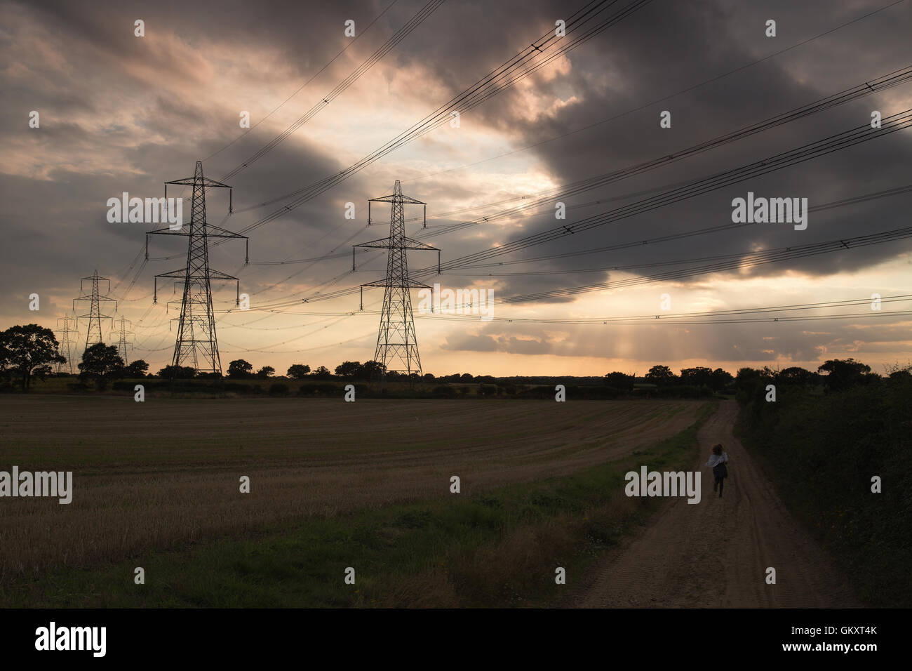 Storm clouds over pylons in Blaxhall village Suffolk England Stock ...