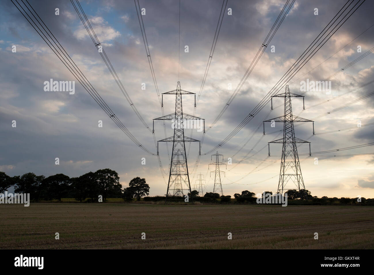 Storm clouds over pylons in Blaxhall village Suffolk England Stock ...