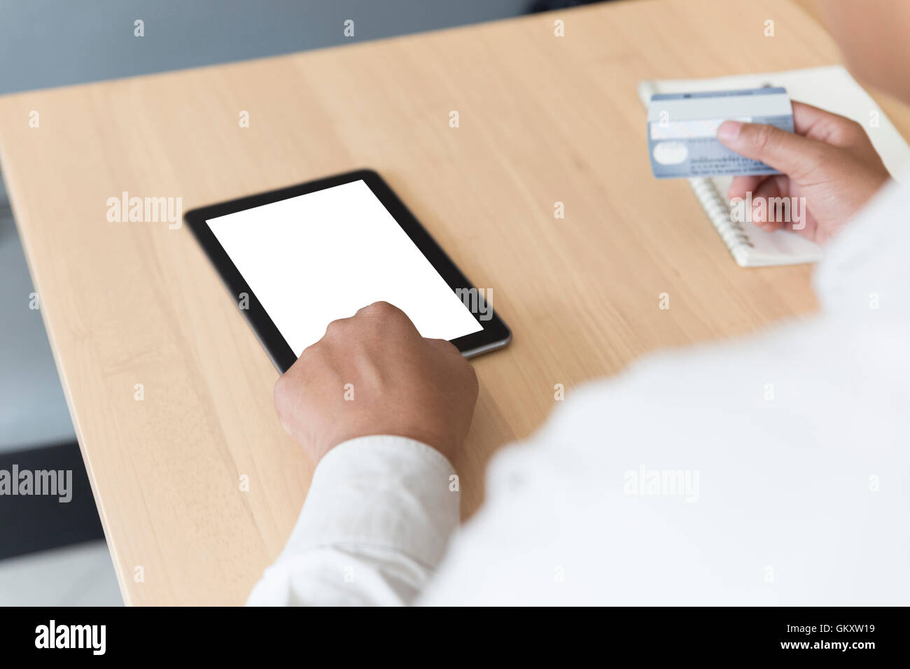 businessman's hand with digital tablet and credit card for payment ...