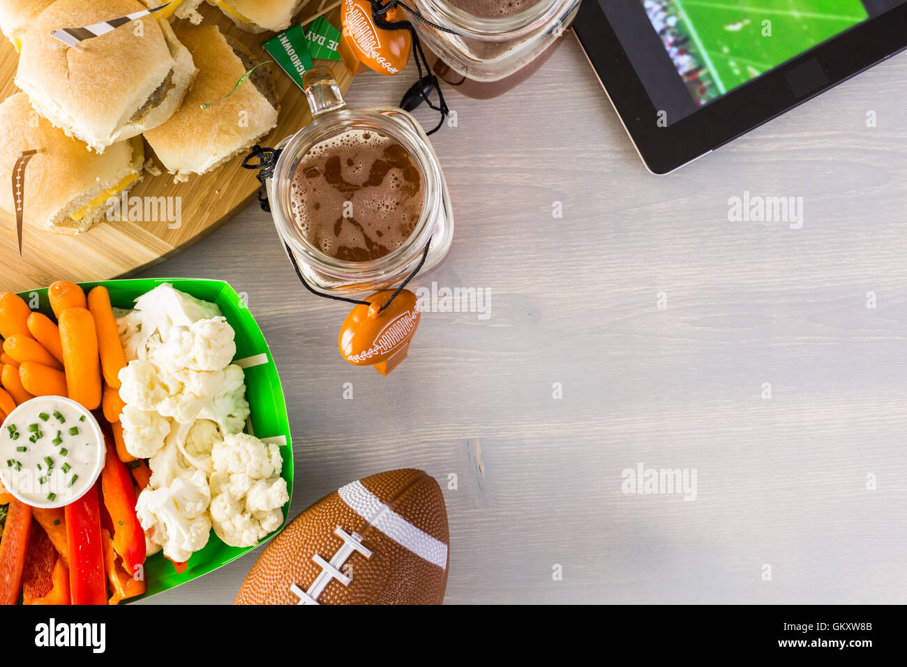 Sliders with veggie tray on the table for the football party Stock ...