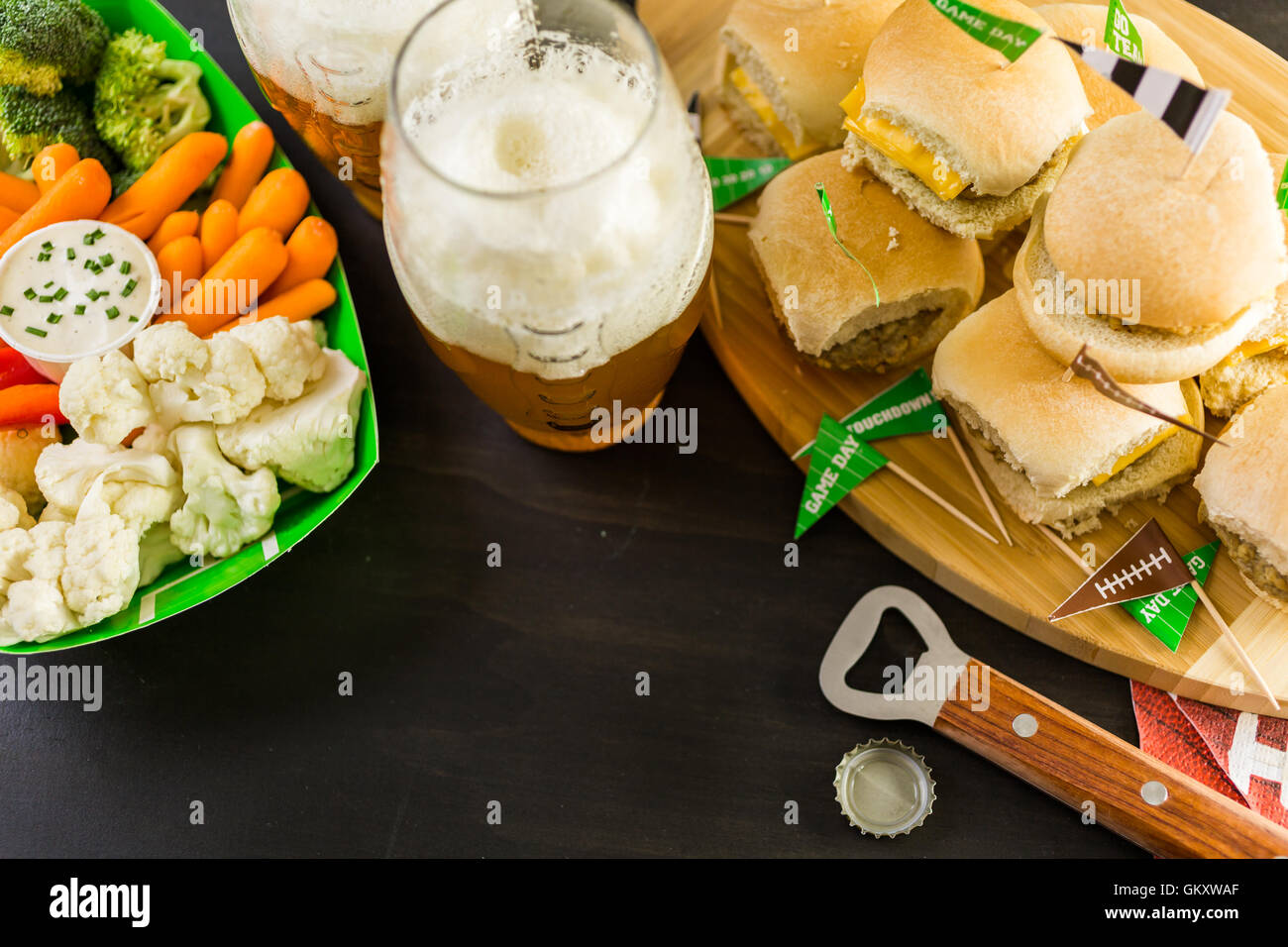 Sliders with veggie tray on the table for the football party Stock ...